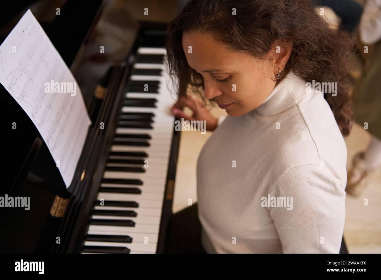 Overhead view of a multi ethnic young woman, charming brunette female ...