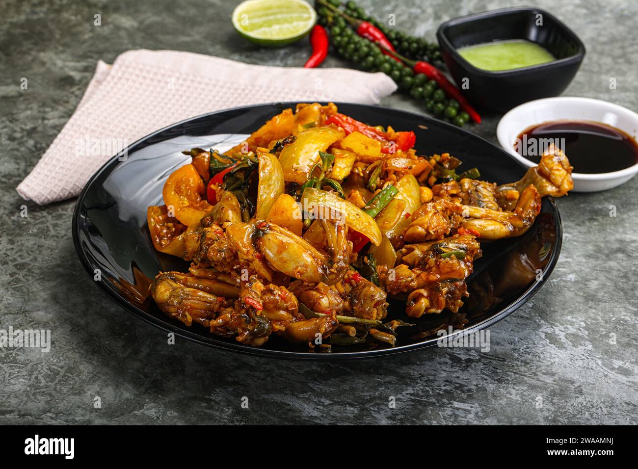 Vietnamese cuisine - fried frog with vegetables and spices Stock Photo ...