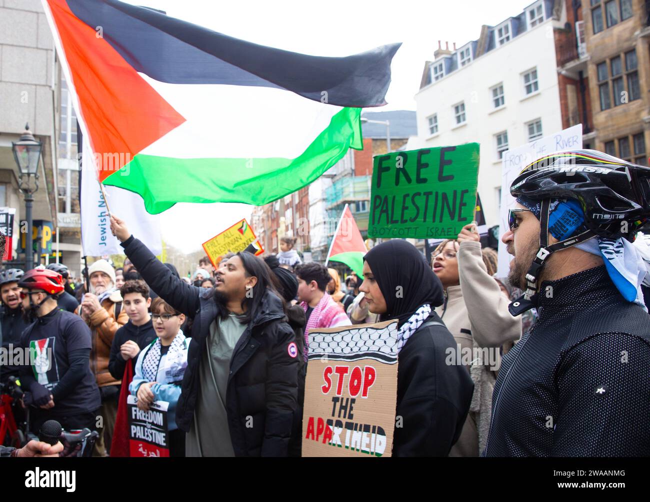 Pro-Palestinian protesters gather with flags and placards during a ...