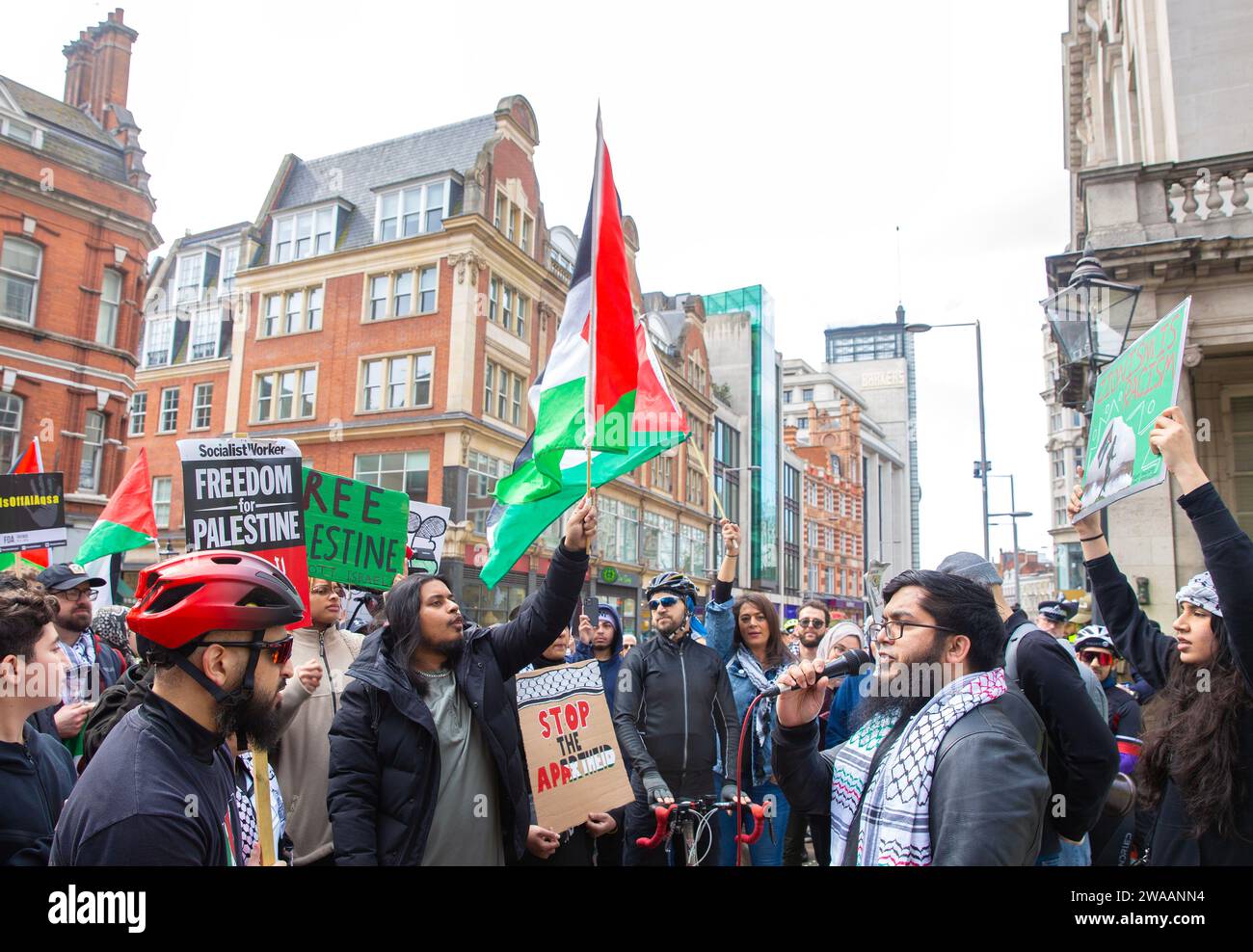 Pro-Palestinian protesters gather with flags and placards during a ...