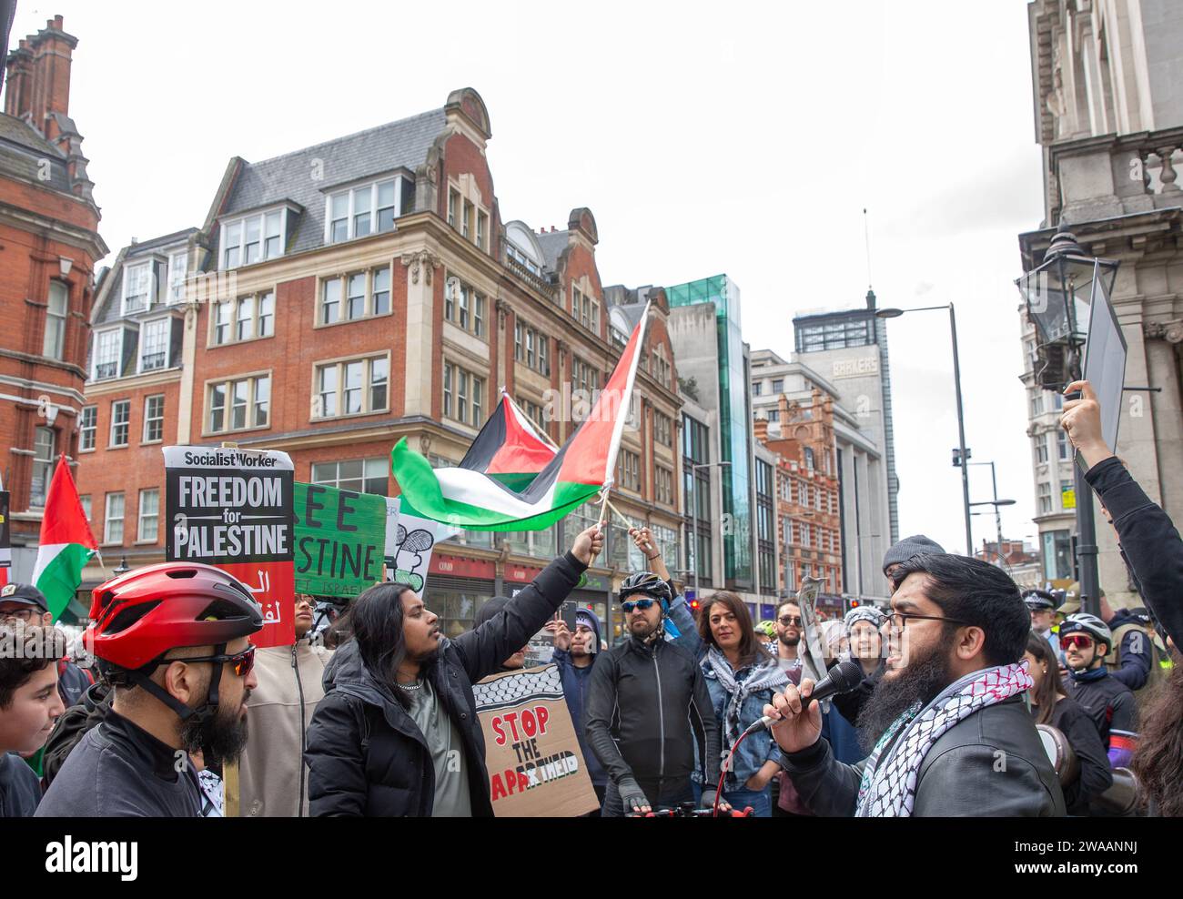 Pro-Palestinian protesters gather with flags and placards during a ...