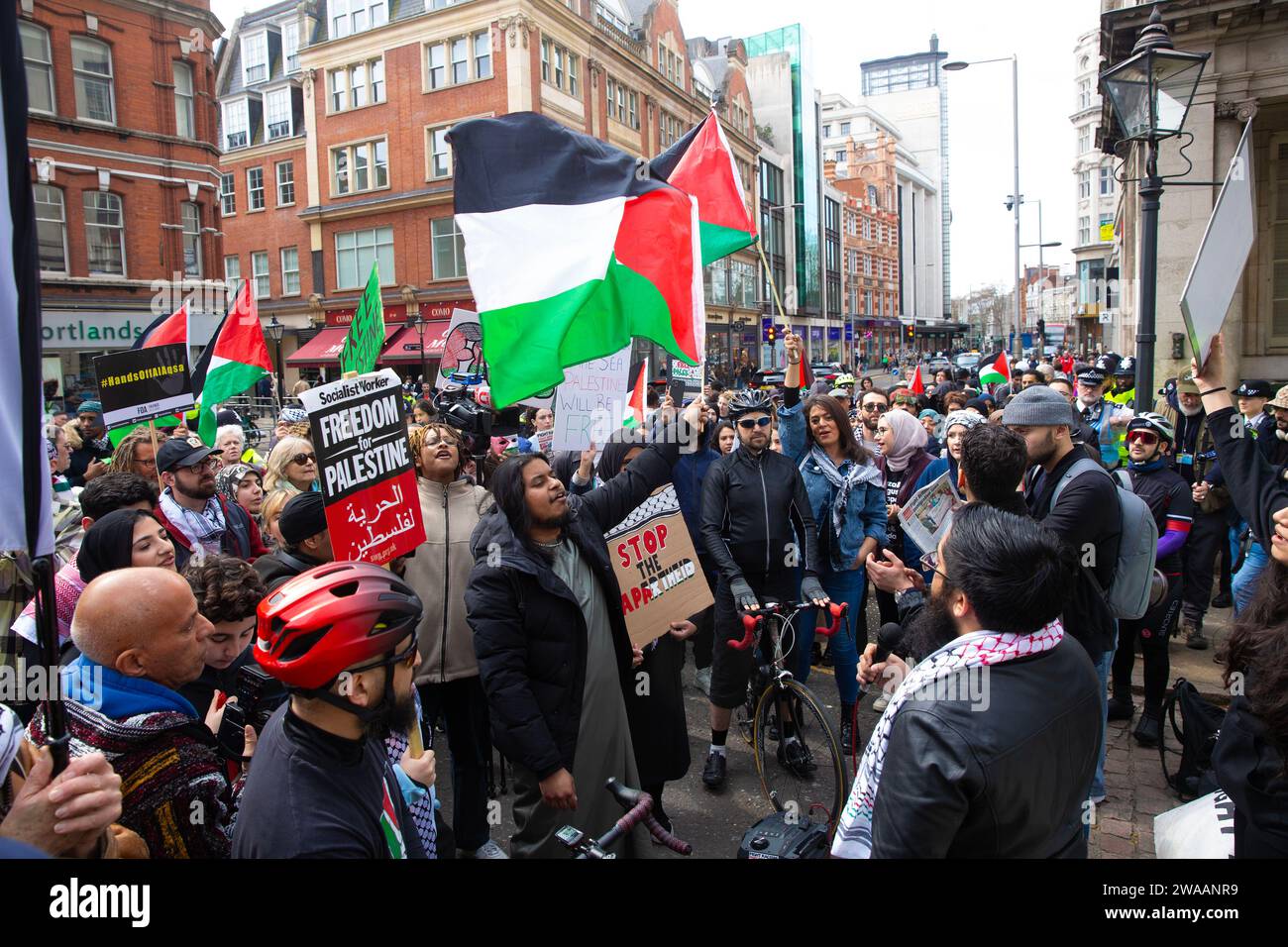 Pro-Palestinian protesters gather with flags and placards during a ...