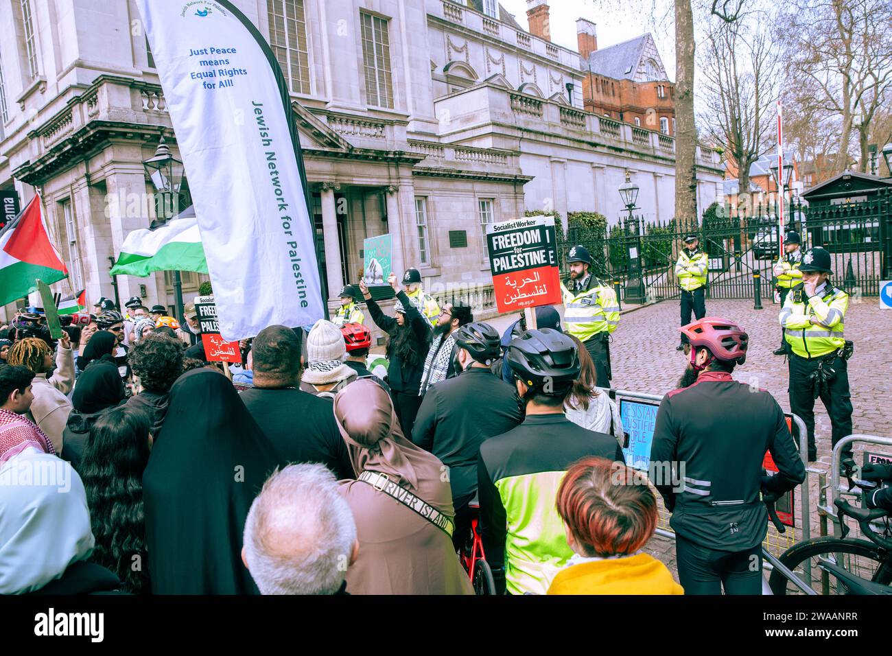 Pro-Palestinian protesters gather with flags and placards during a ...