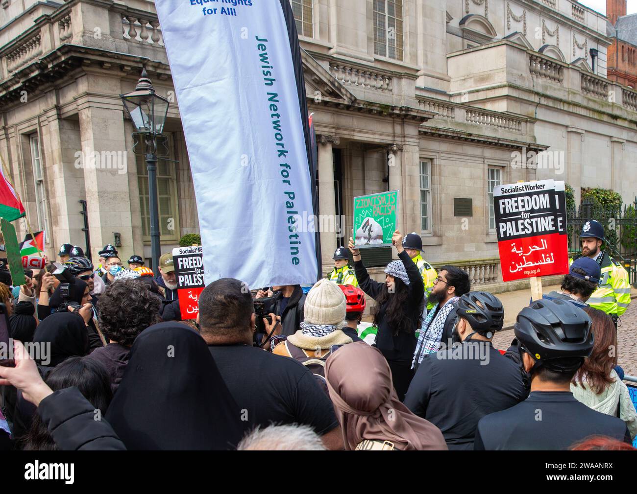 Pro-Palestinian protesters gather with flags and placards during a ...