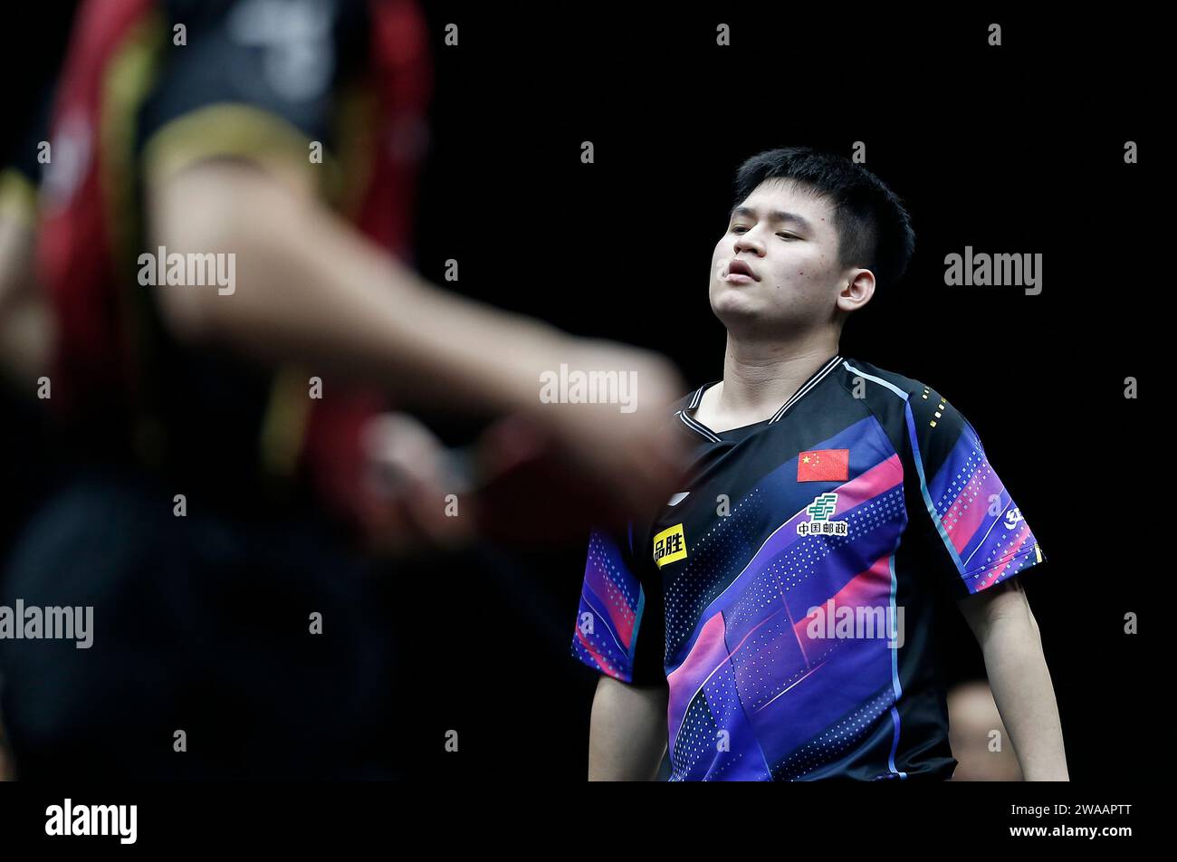 Doha, Qatar. 3rd Jan, 2024. Lin Shidong reacts during the men's singles ...