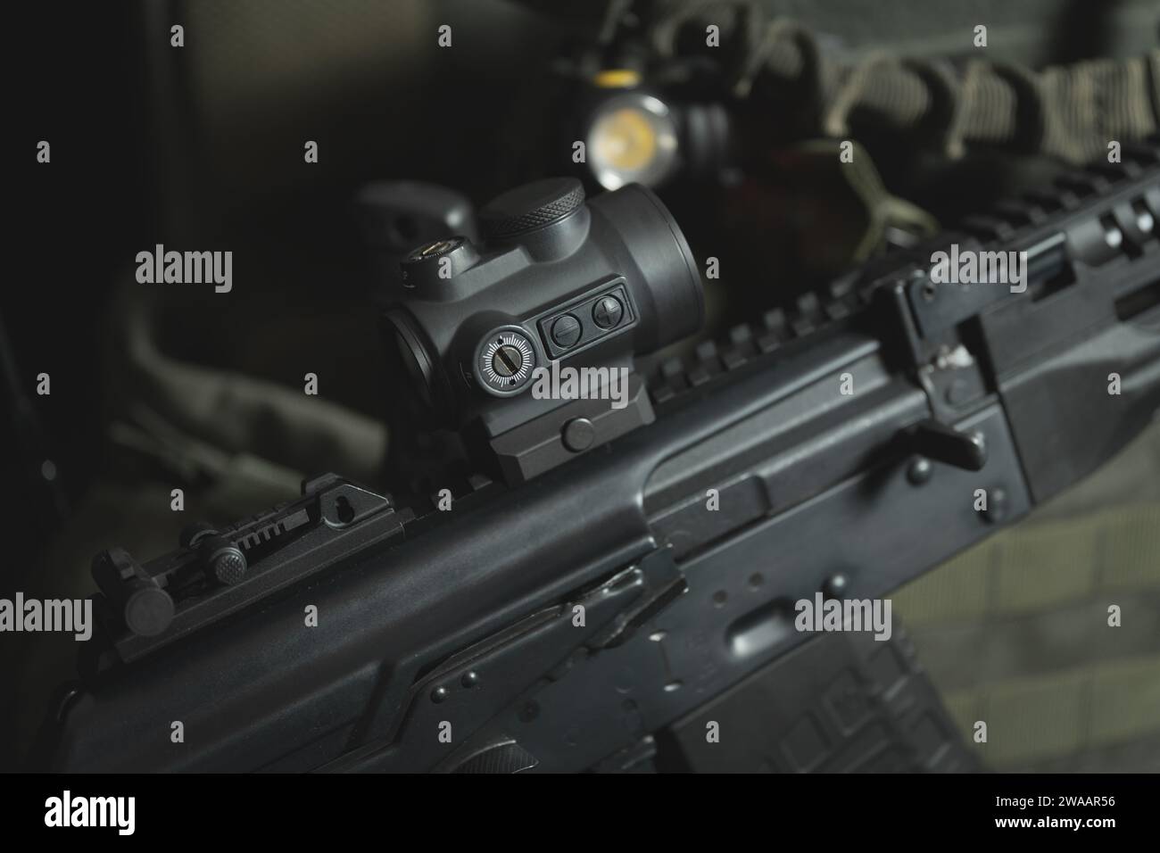 A modern red dot sight is installed on an AK 12, close-up photo. High ...