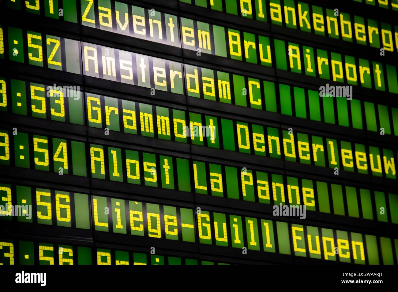 Late night crowd of people a front of information board at the airport ...