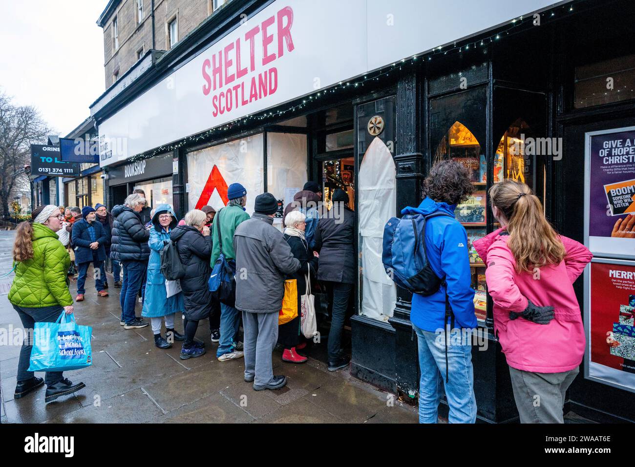 Customers queue outside the Shelter Scotland charity shop in Edinburgh ...