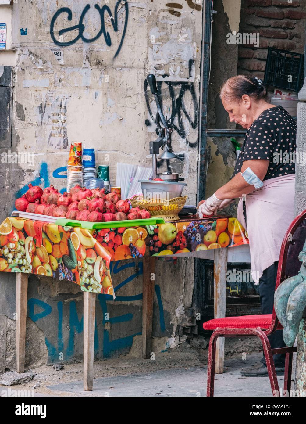 Old lady selling pomegranates near Shota Rustaveli avenue in Mtatsminda ...