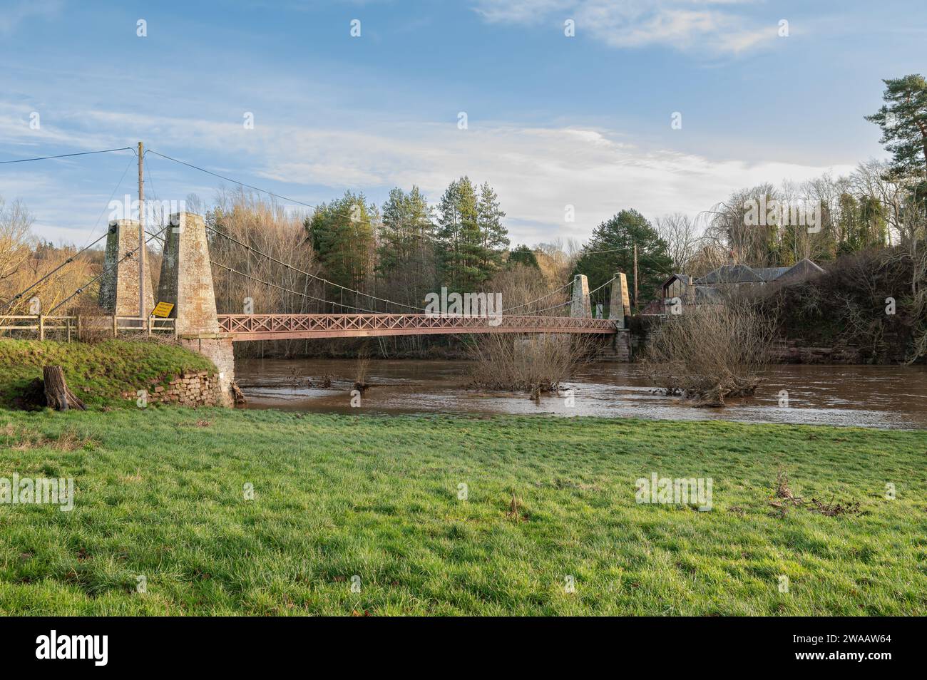 Kalemouth Suspension Bridge over the Teviot River in flood after storm ...
