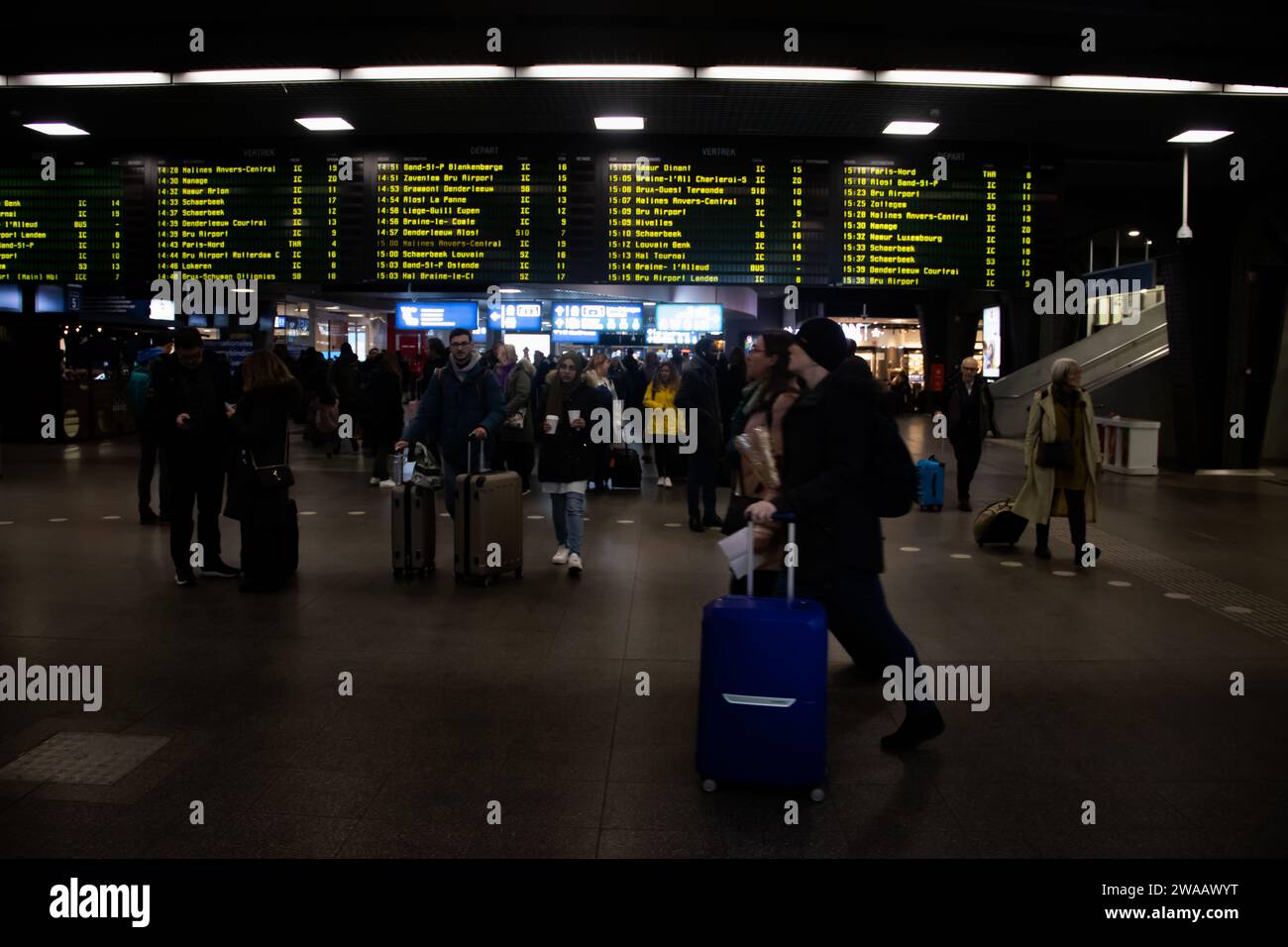 Late night crowd of people a front of information board at the airport ...