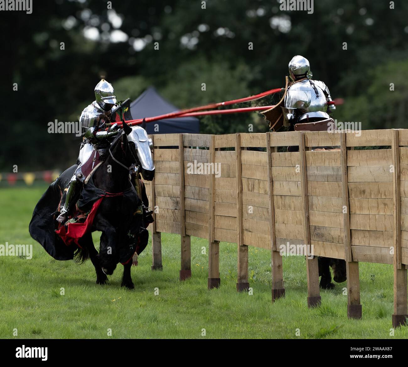 Kenilworth England 07 29 2023 Two Knights jousting hitting lances on ...