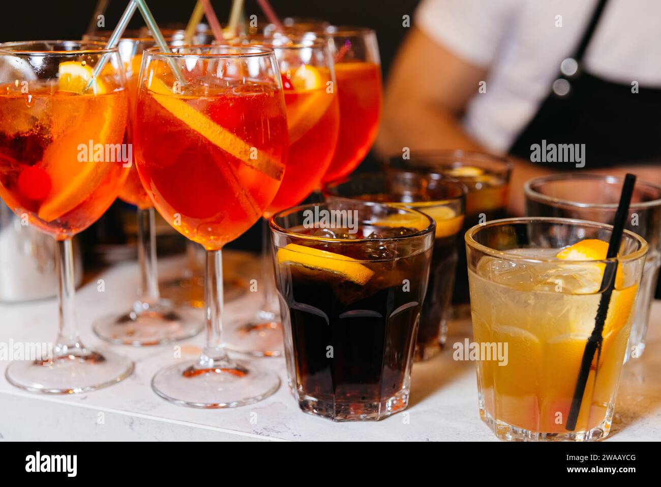 An inviting selection of colorful cocktails, including Aperol Spritz ...
