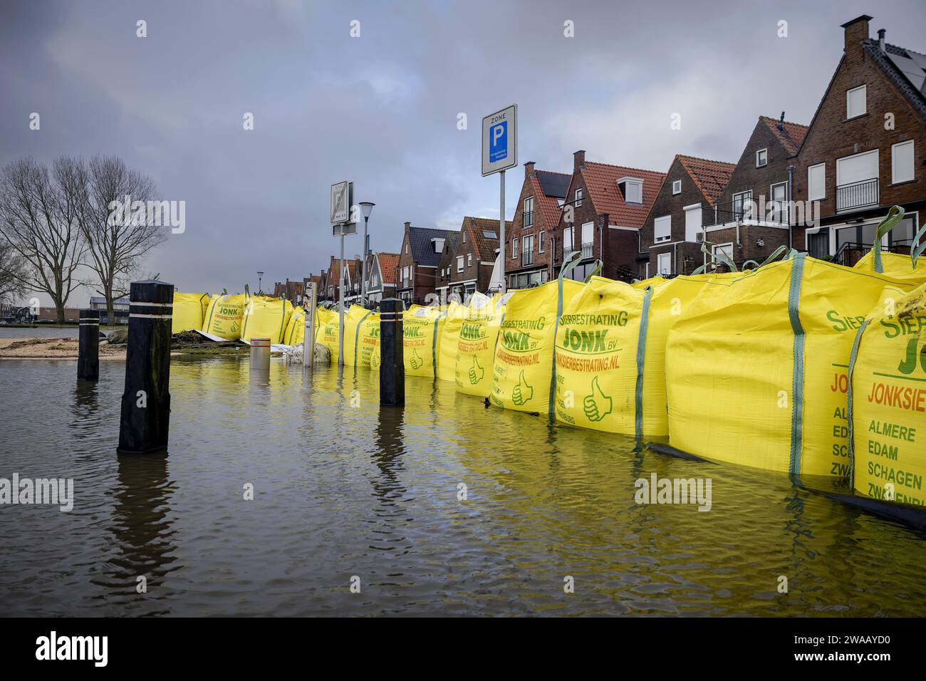 Volendam, Netherlands. 3 January, 2023. Sandbags in a flooded street ...