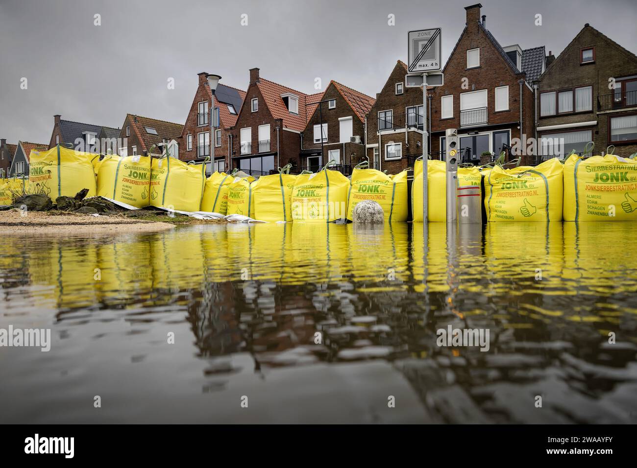 Volendam, Netherlands. 3 January, 2023. Sandbags in a flooded street ...