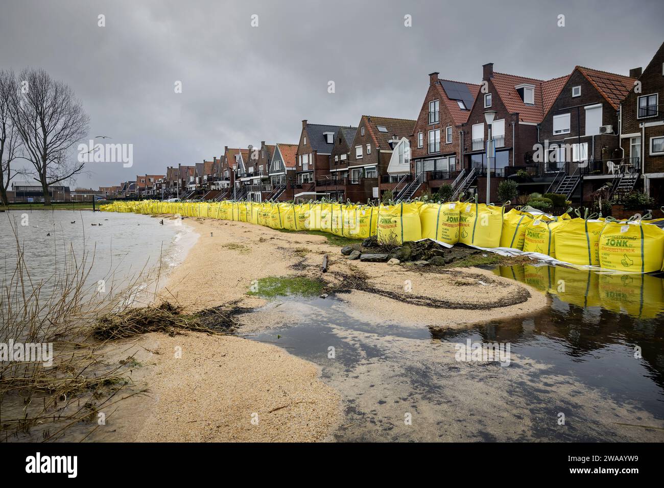 Volendam, Netherlands. 3 January, 2023. Sandbags in a flooded street ...