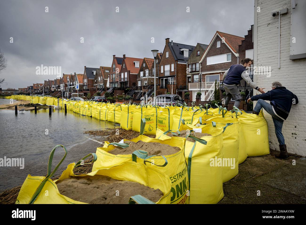 Volendam, Netherlands. 3 January, 2023. Sandbags in a flooded street ...