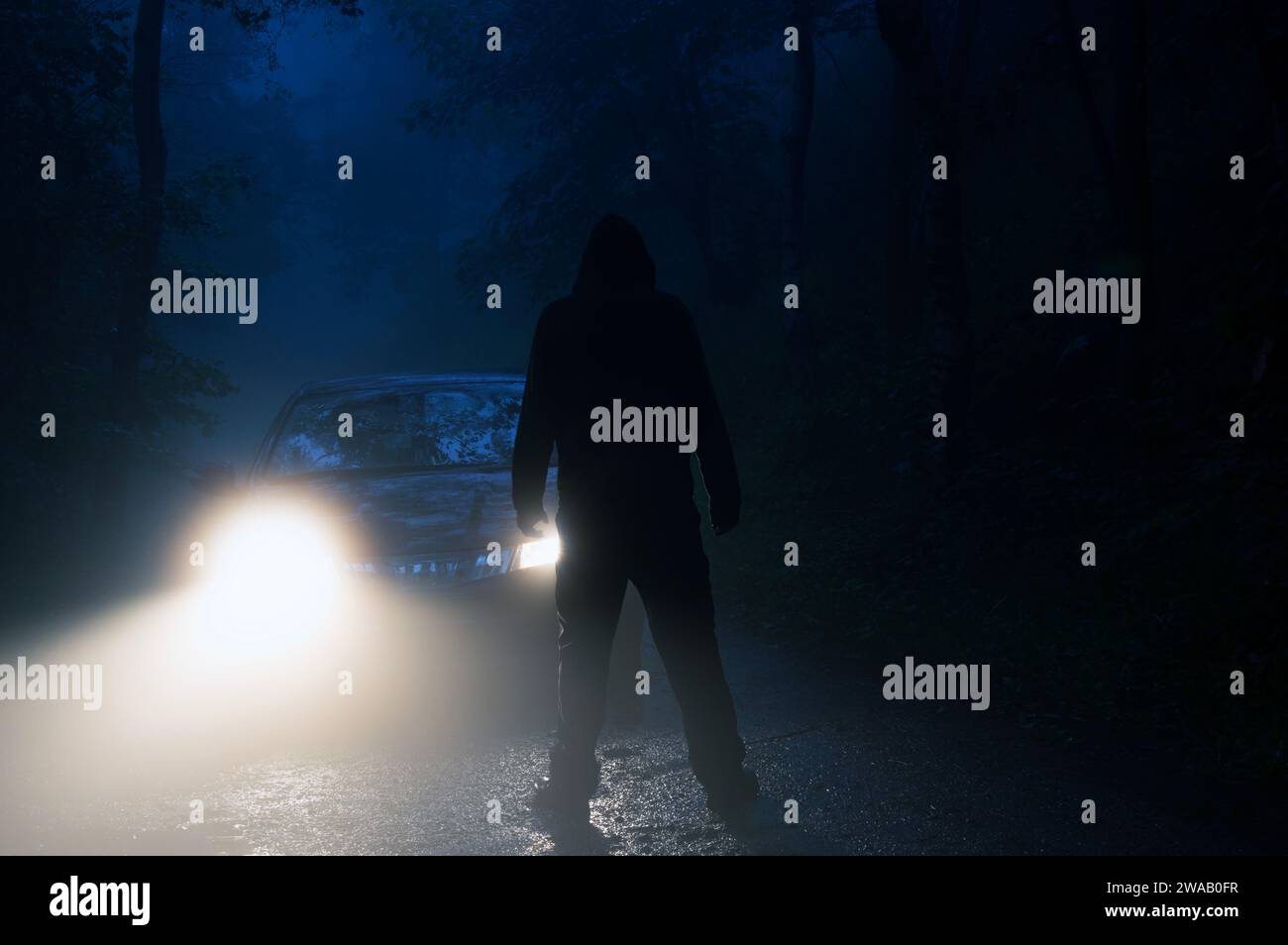 Man standing in front headlights hi-res stock photography and images ...