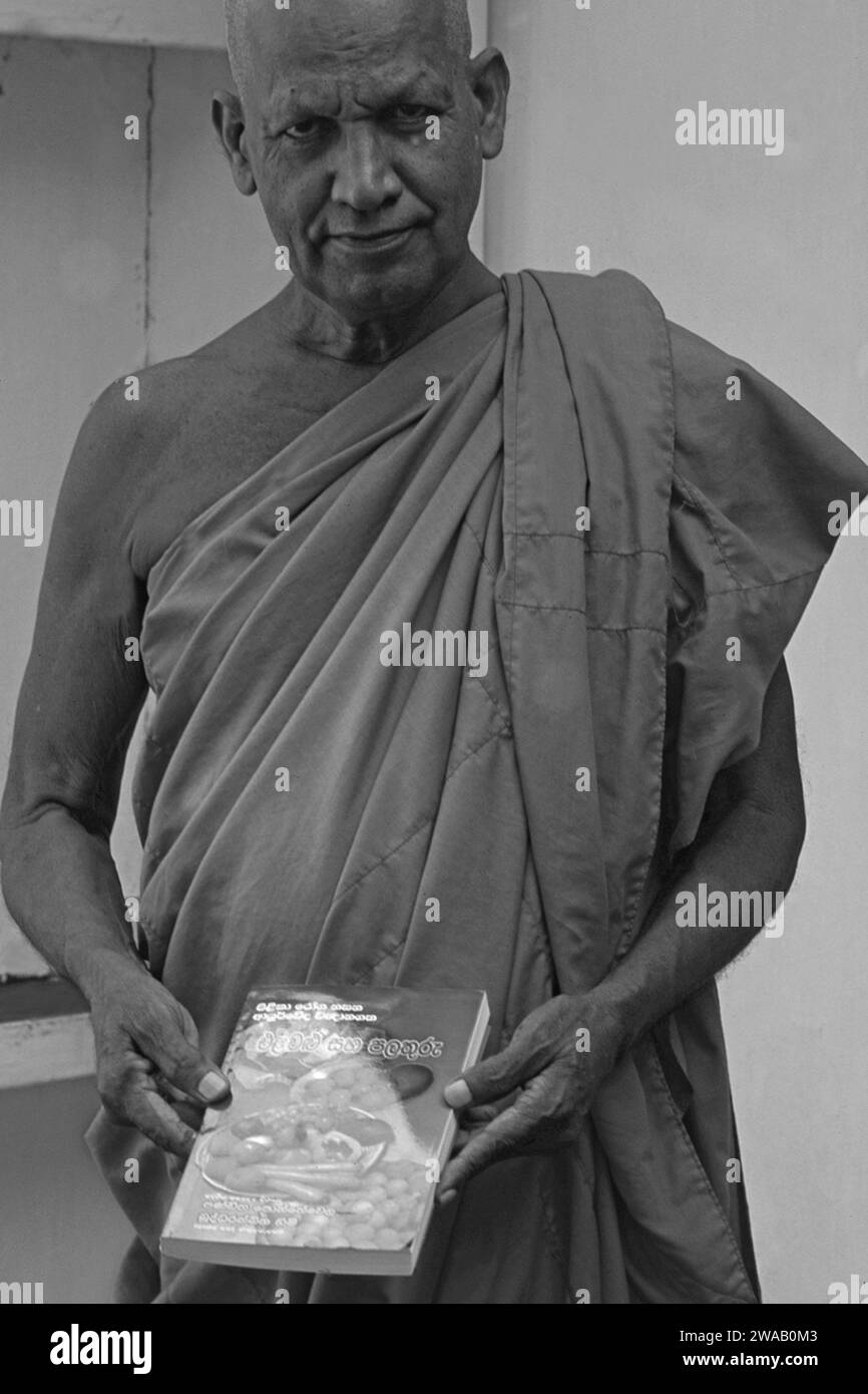 India: A buddhist monk showing his herbal ayurevedic medicin cooking ...