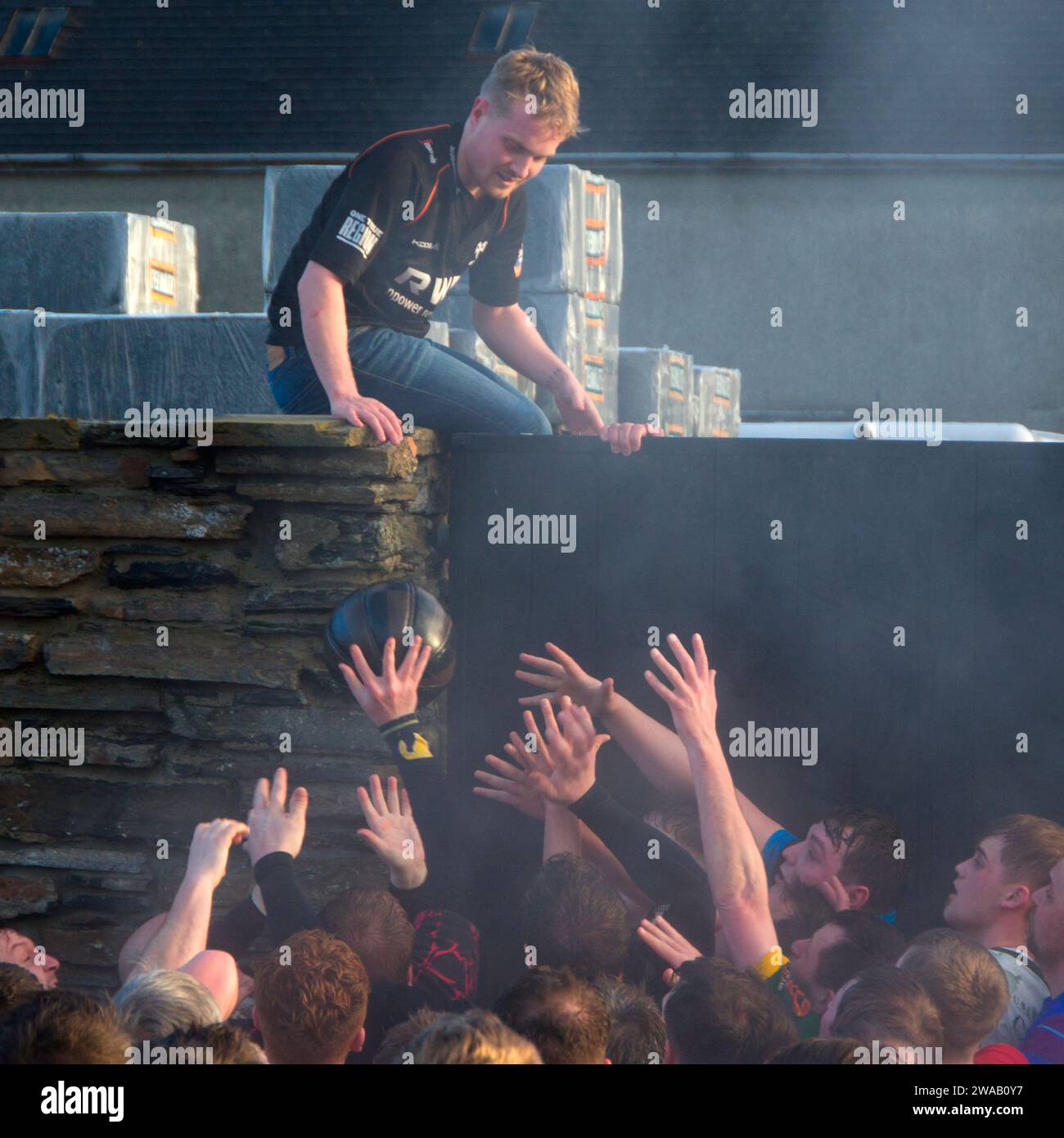 Stealing the Ba, Kirkwall New Year street game 2024 Stock Photo - Alamy
