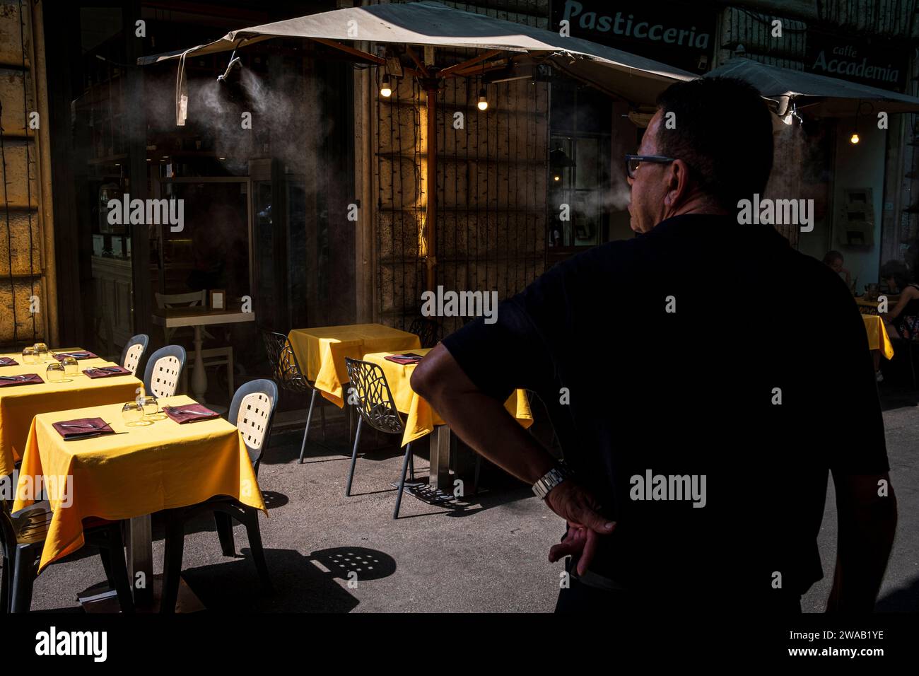 Rome, Italy - 12 August 2022 : Man smoking in the street Stock Photo ...