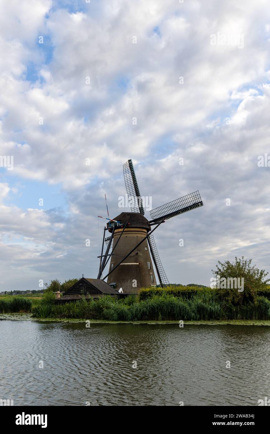Beautiful wooden windmills at sunset in the Dutch village of Kinderdijk ...