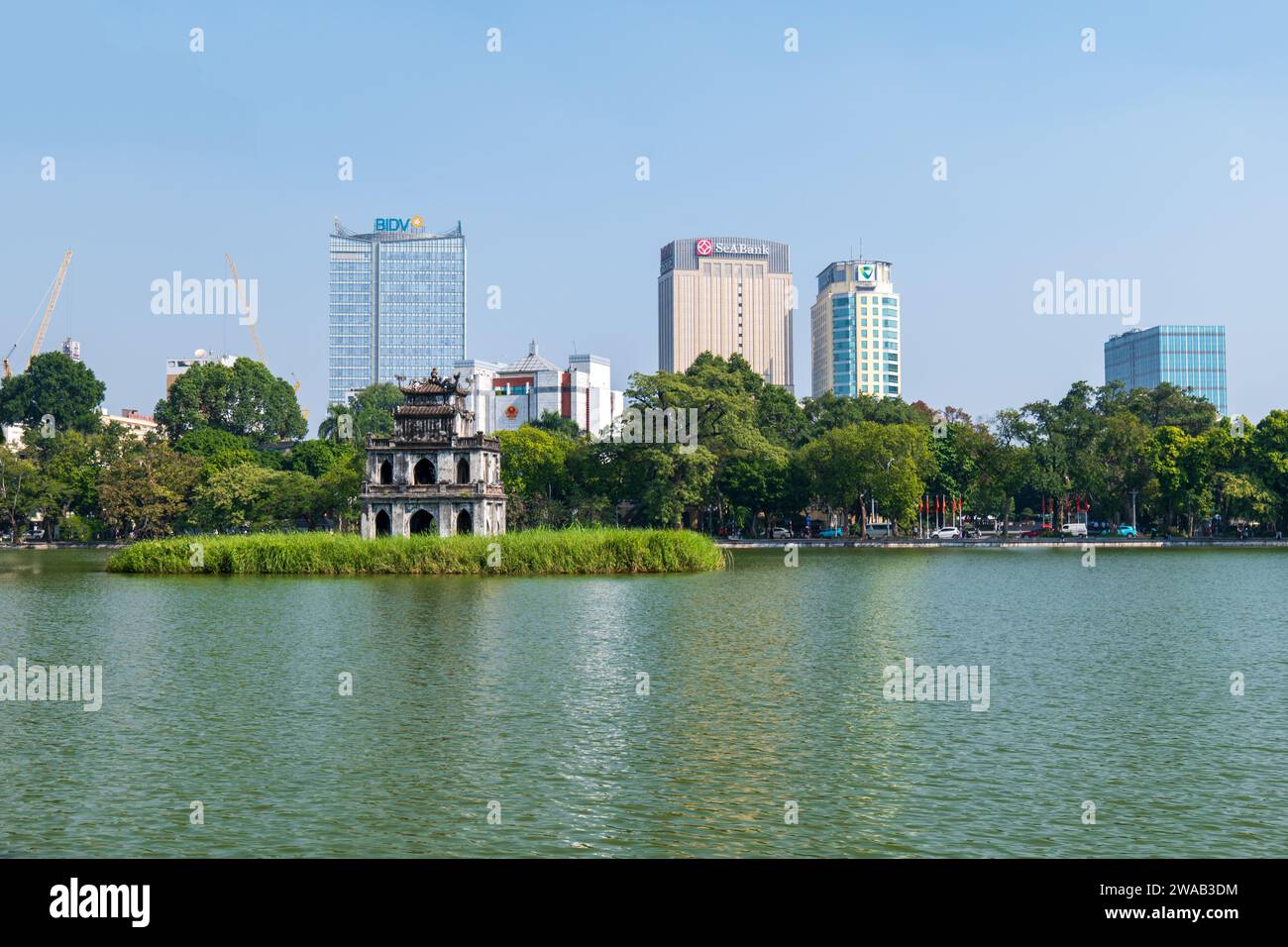 Hoan Kiem lake in Hanoi, Vietnam, with famous Turtle tower. An iconic ...