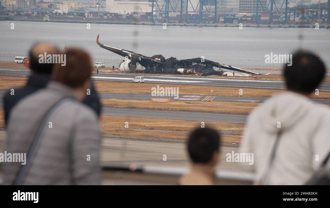 Tokyo, Japan. 03rd Jan, 2024. Peoples look out at the burnt Japan ...