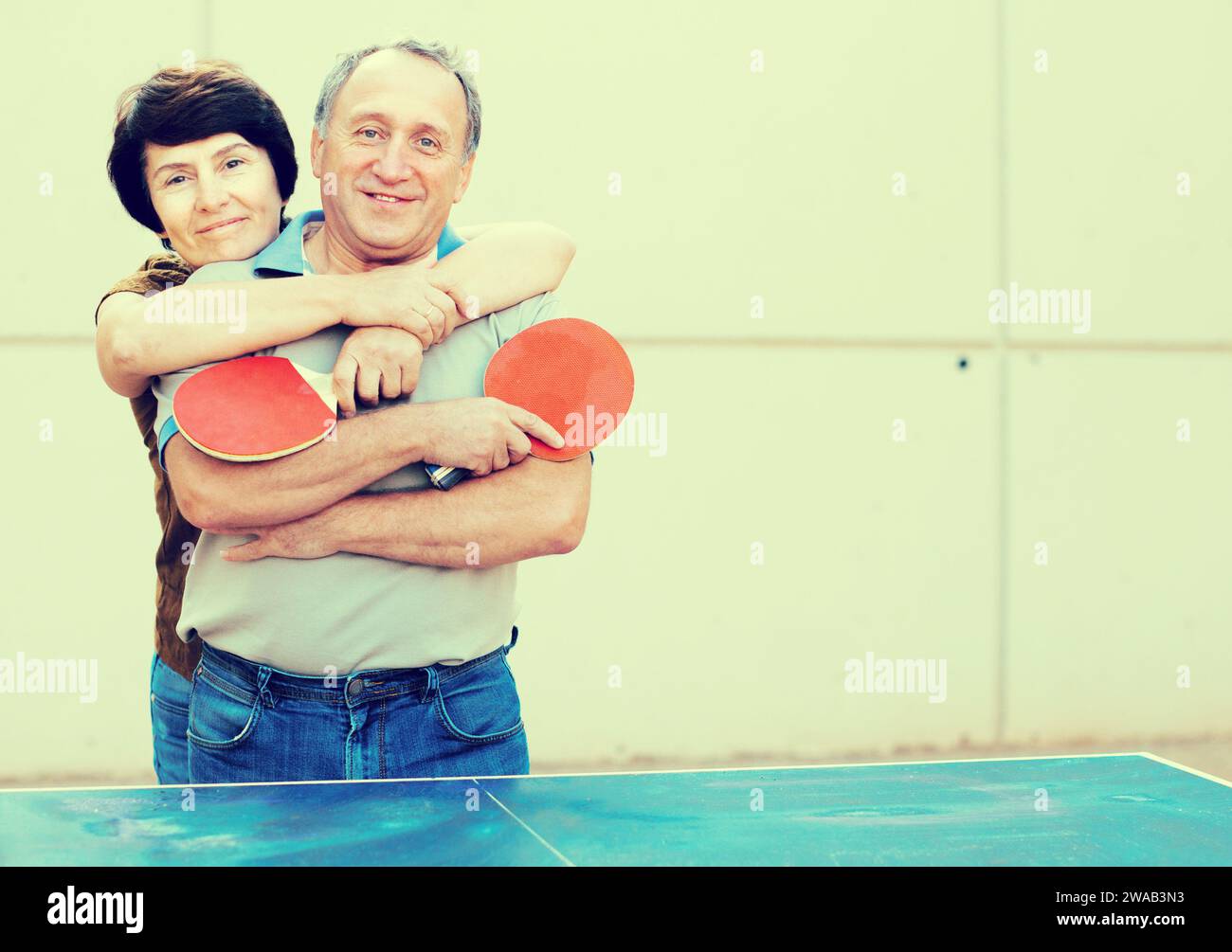 Old couple playing table tennis hi-res stock photography and images - Alamy