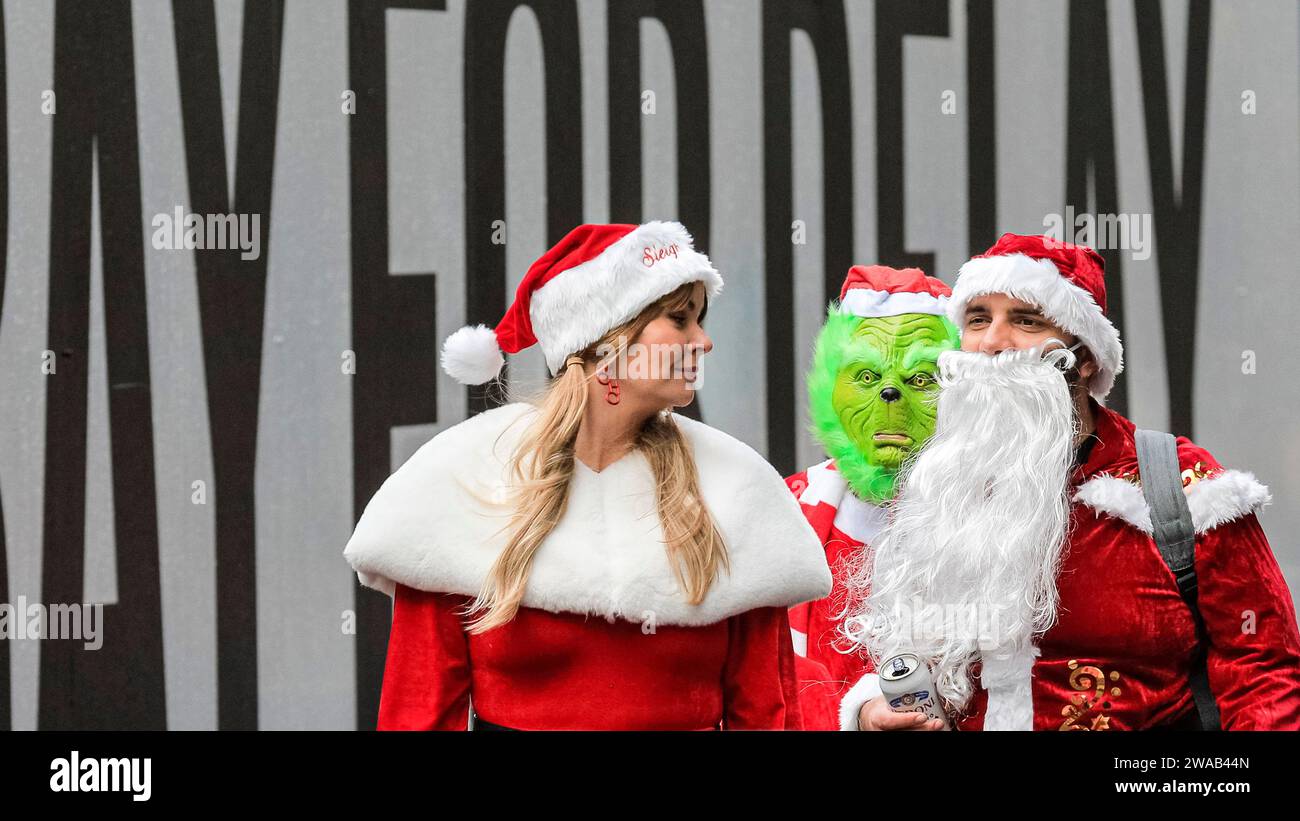 The Grinch with participants and revellers at SantaCon London Christmas ...