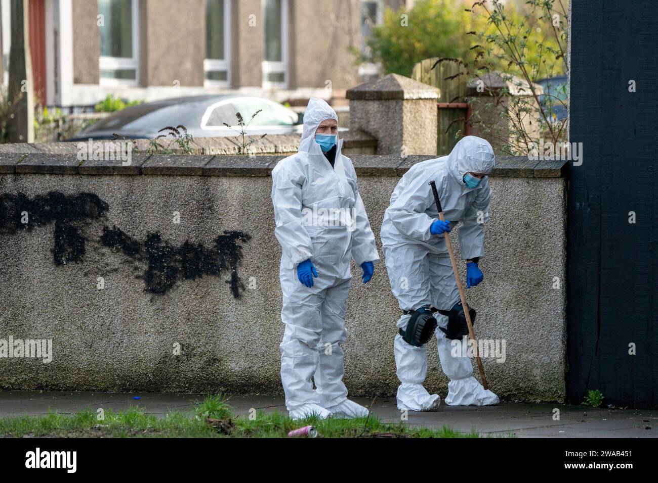 Police forensic officers search the area close to the scene near the ...