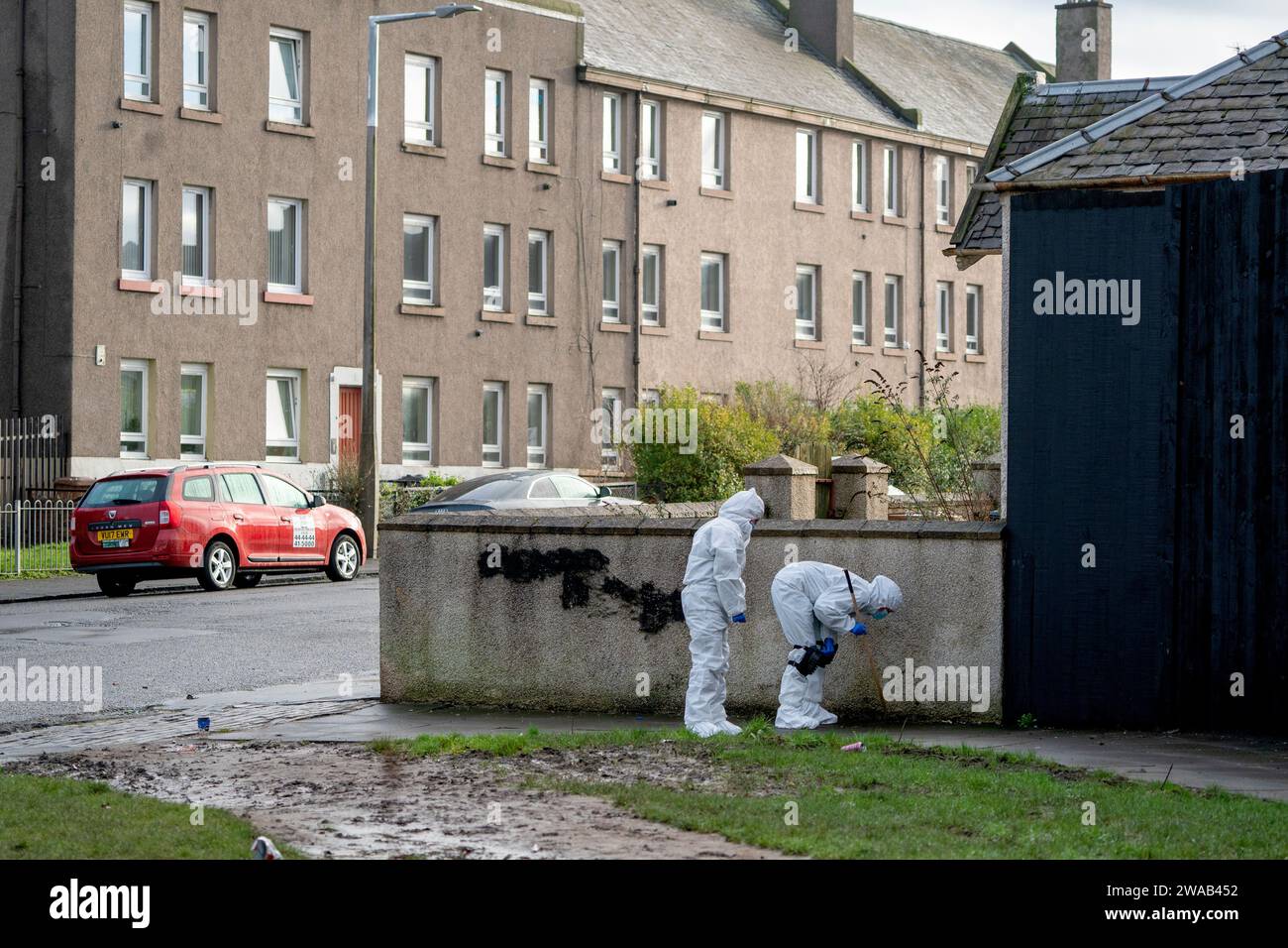Police forensic officers search the area close to the scene near the ...
