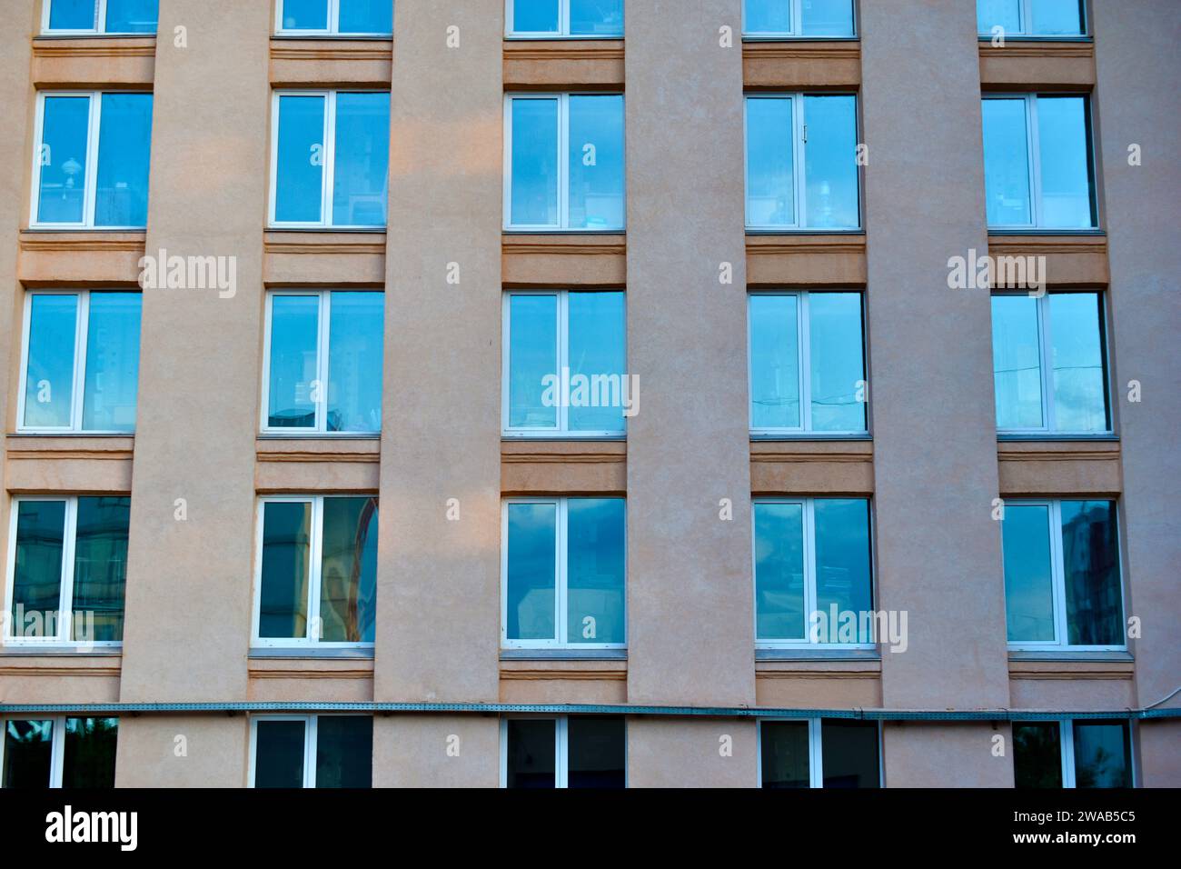 The facade of a classic building in the city. The windows of the ...