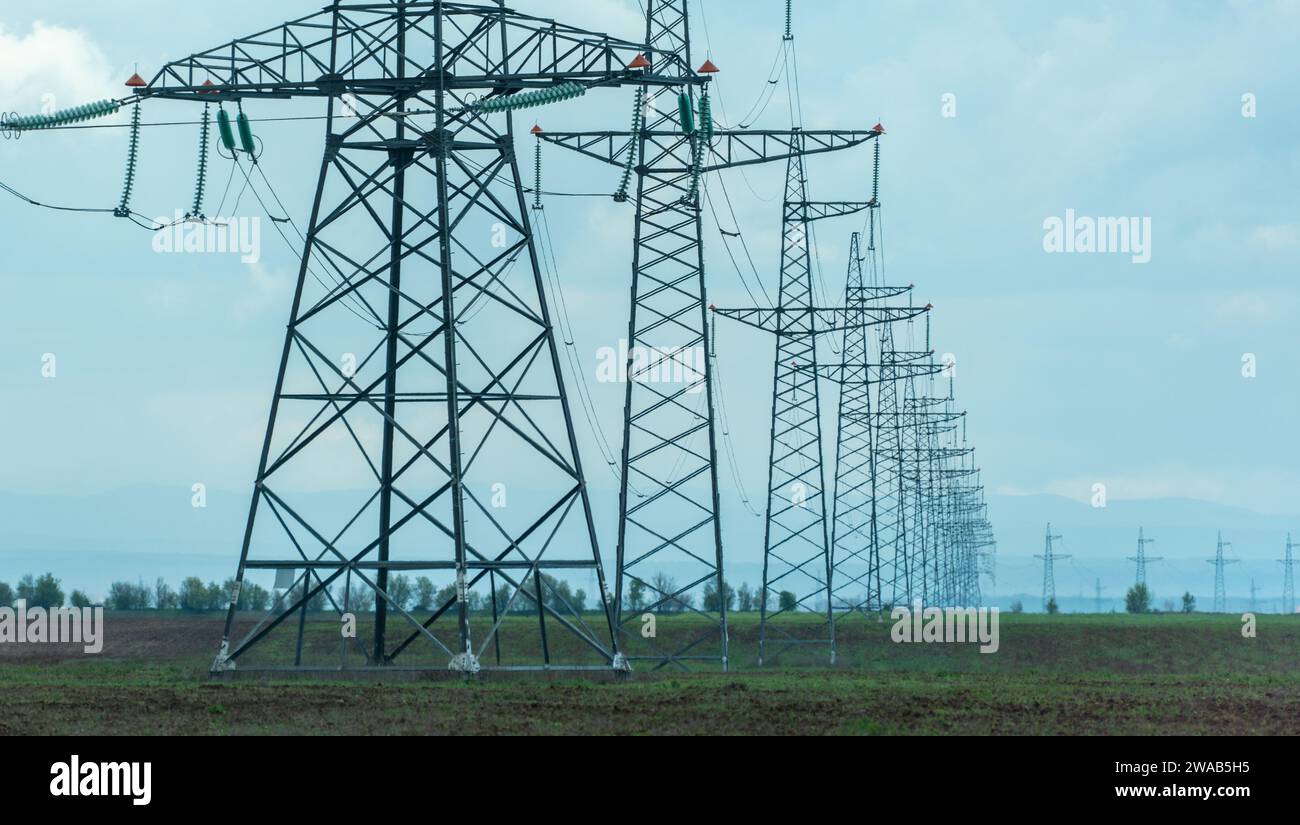 High voltage towers with sky background. Power line support with wires ...