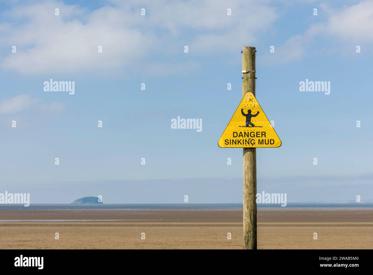 A danger of sinking mud sign on the beach at the seaside town of Weston ...