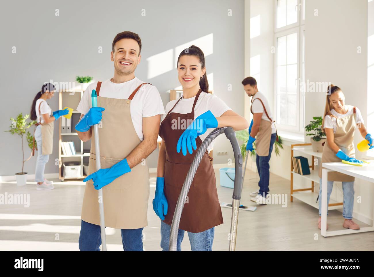 Male, female cleaners posing, group working, professional janitor ...