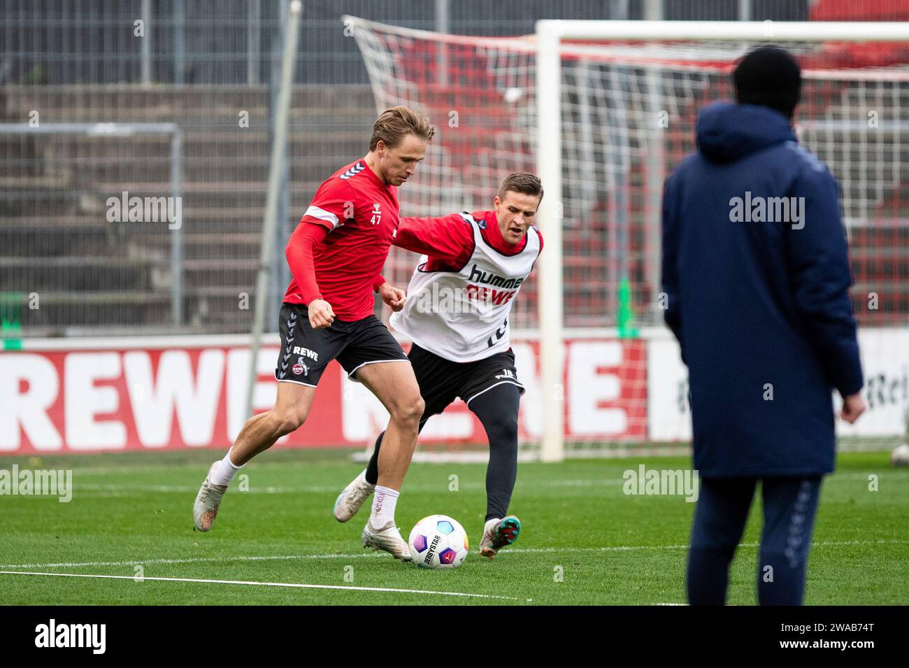 Koeln, Deutschland. 03rd Jan, 2024. Mathias Olesen (1.FC Koeln, 47) im Zweikampf mit Rasmus ...