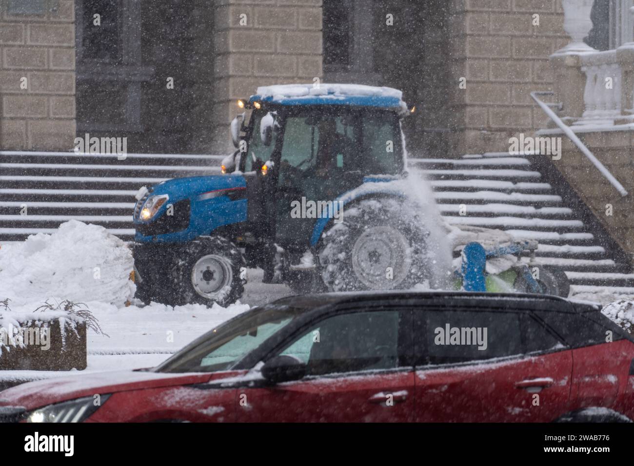 Snow removal machines operating on snowy city streets Stock Photo - Alamy