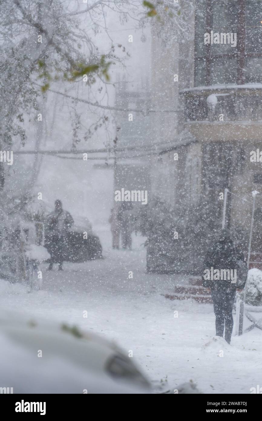 City street under the snow during snow blizzard in winter Stock Photo ...