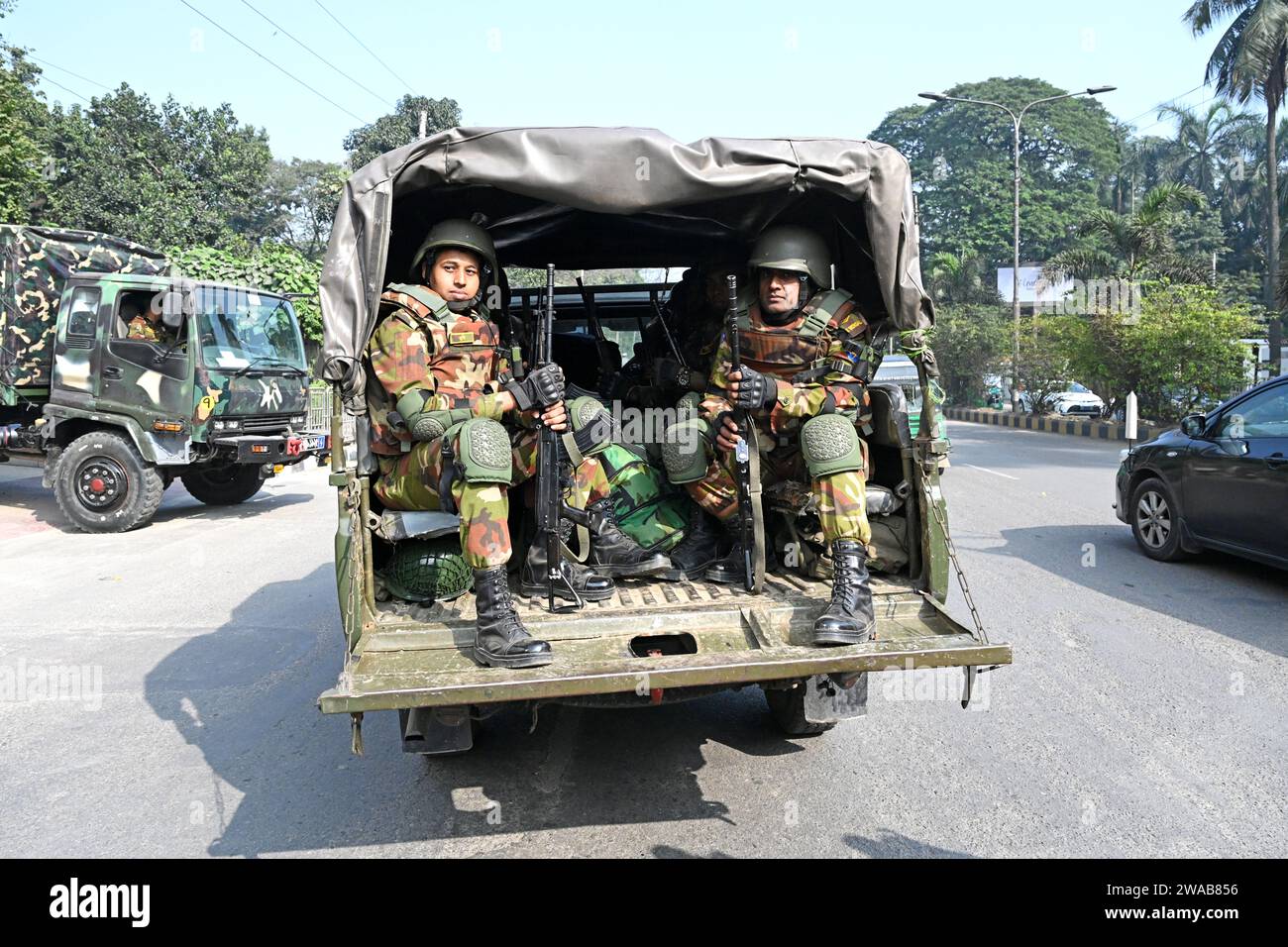 Dhaka, Bangladesh. 03rd Jan, 2024. Bangladesh Army personnel sit in the ...
