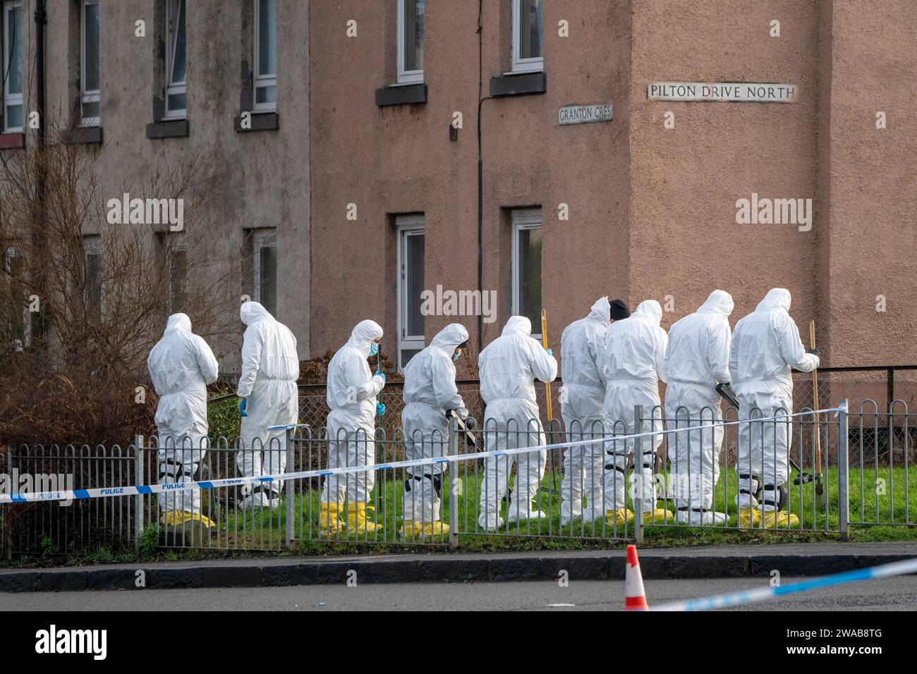 Police forensic officers search the area close to the scene near the ...