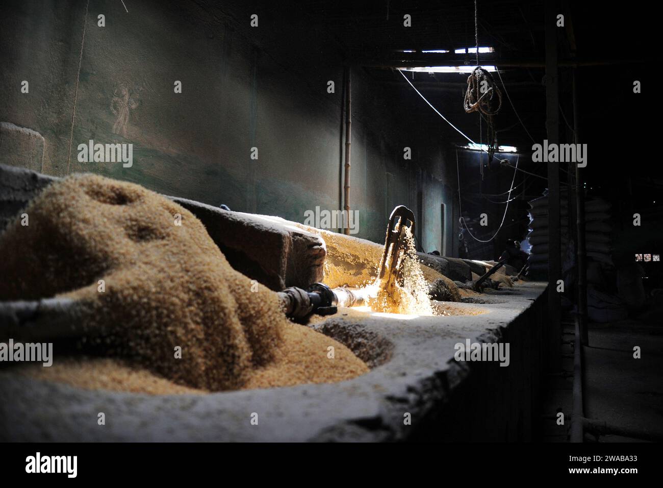 Bangladeshi worker works in a puffed rice factory in Dhaka City in ...