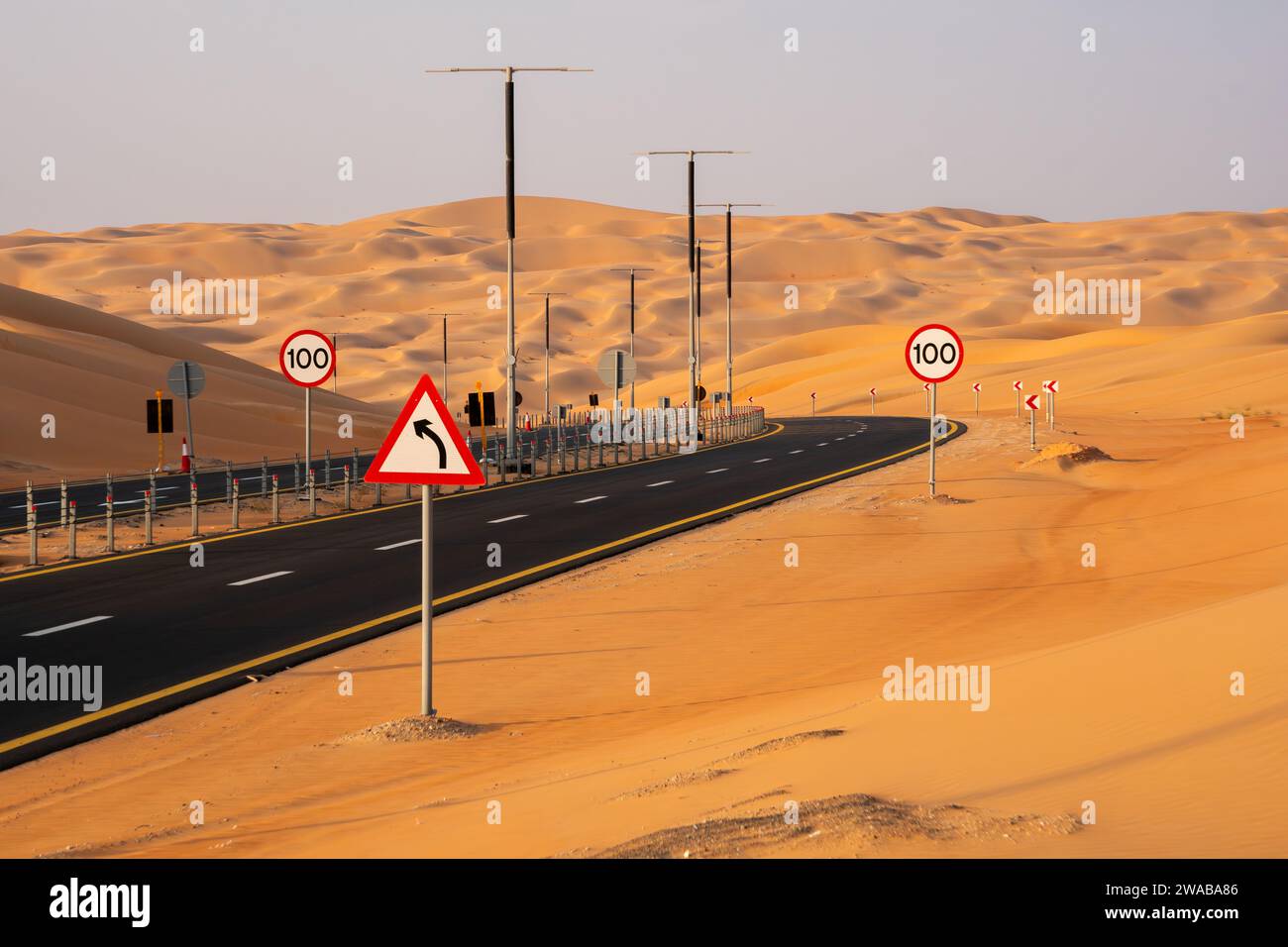 The road towards Moreeb Dune in Rub Al Khali, UAE, is surrounded by ...