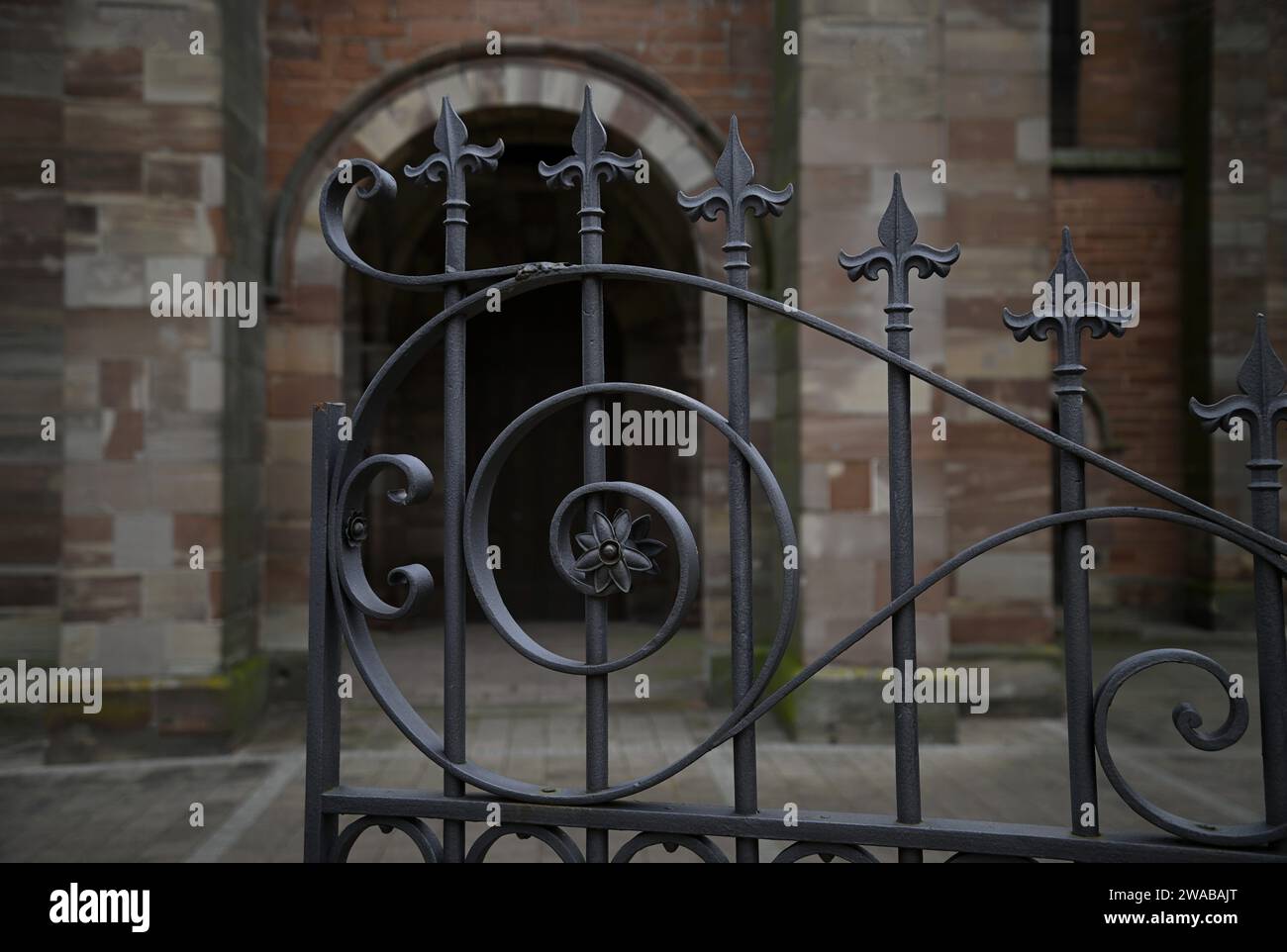 Antique handcrafted wrought iron entrance gate of the Neo-Romanesque ...