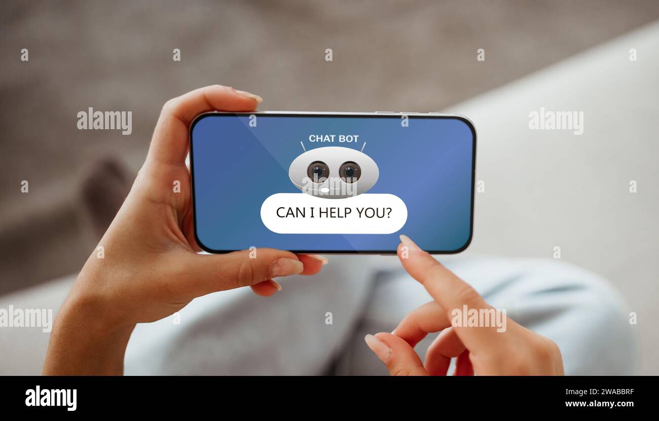 Woman hands using chatbot on smartphone, home interior Stock Photo - Alamy