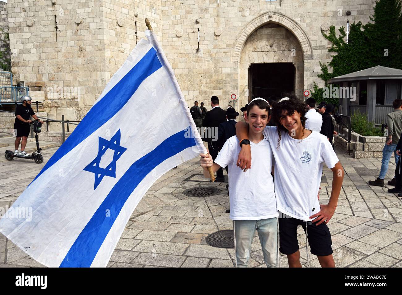 Jewish boys carry an israeli flag Stock Photo - Alamy