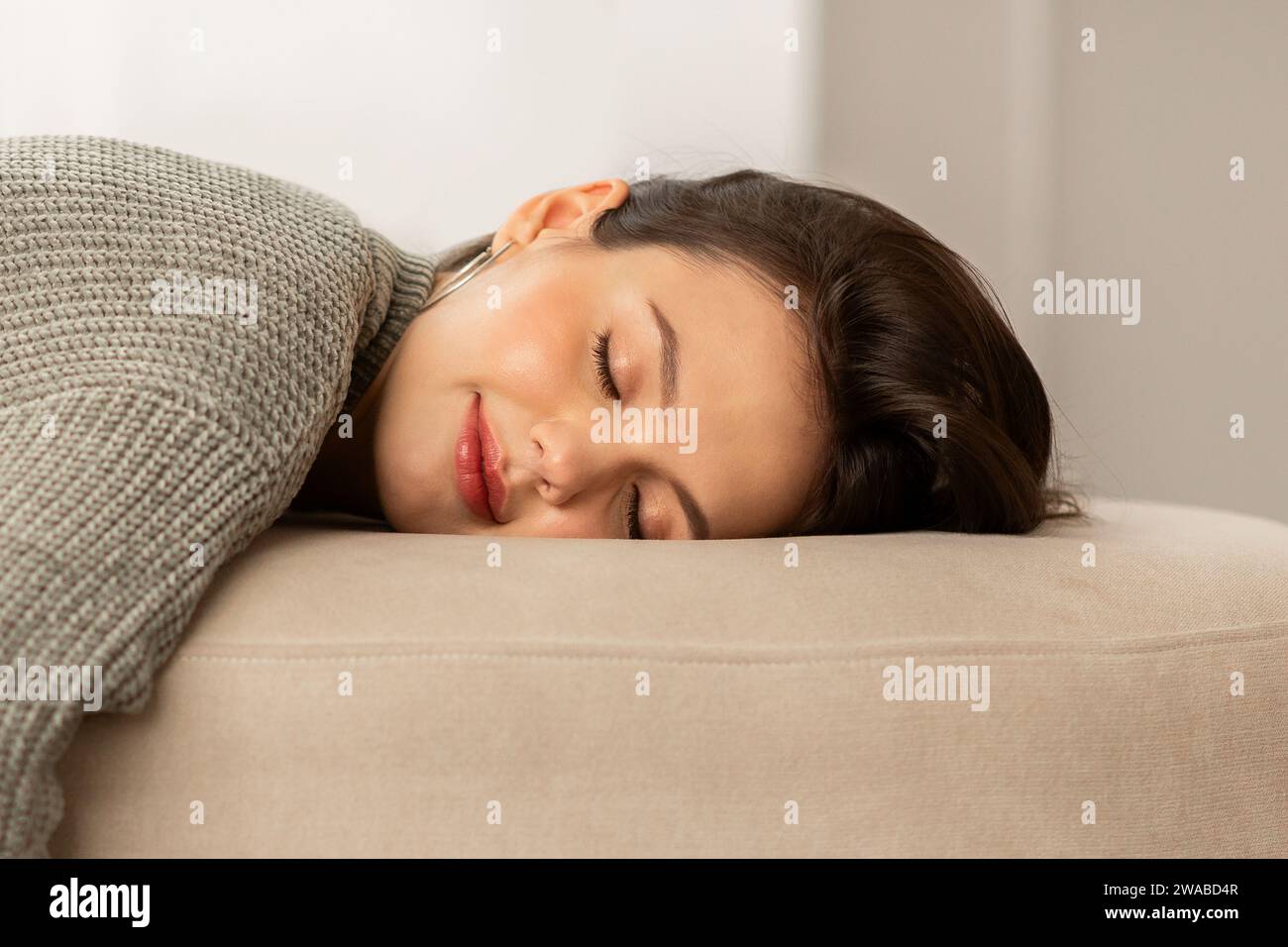 Sleeping woman taking nap on the sofa during the day Stock Photo - Alamy