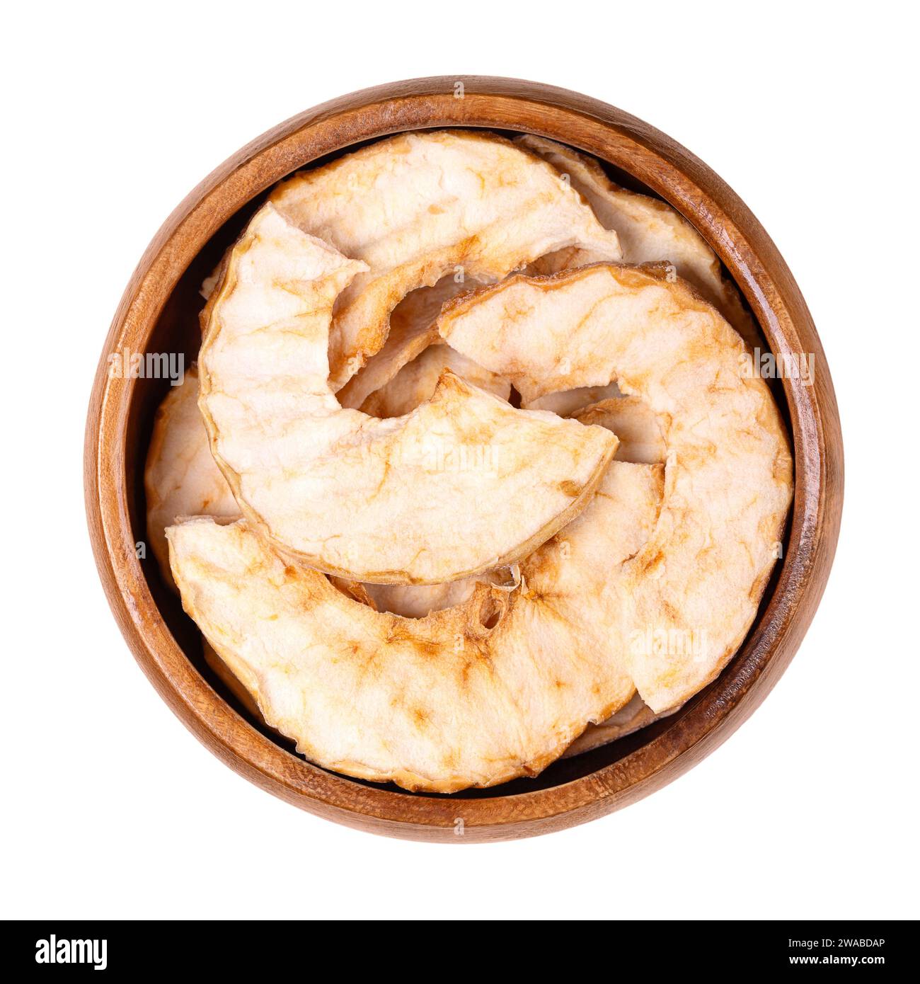 Riffled apple chips, a healthy snack, in a wooden bowl. Dehydrated ...