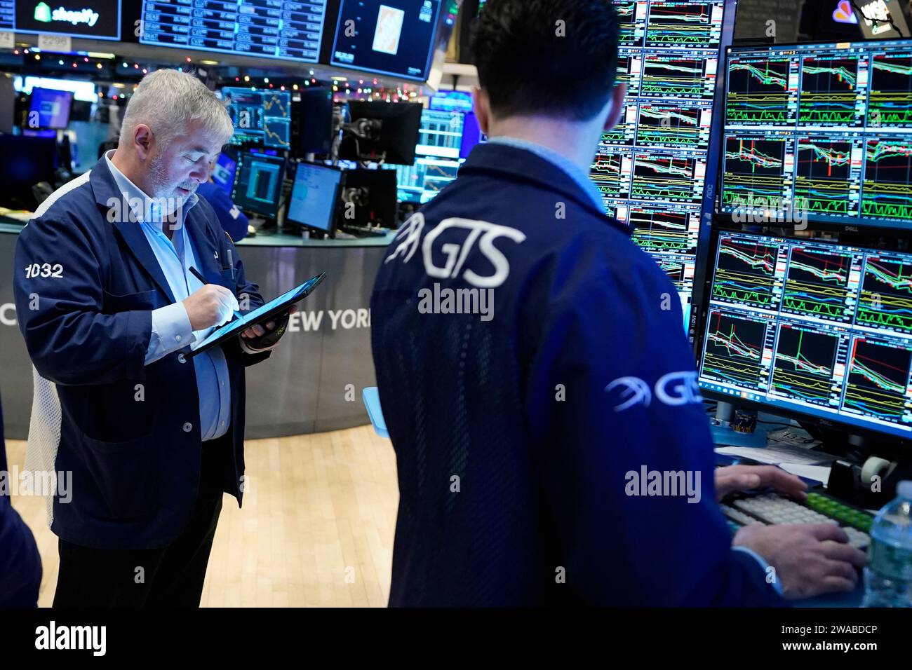 Traders work on the floor at the New York Stock Exchange in New York ...