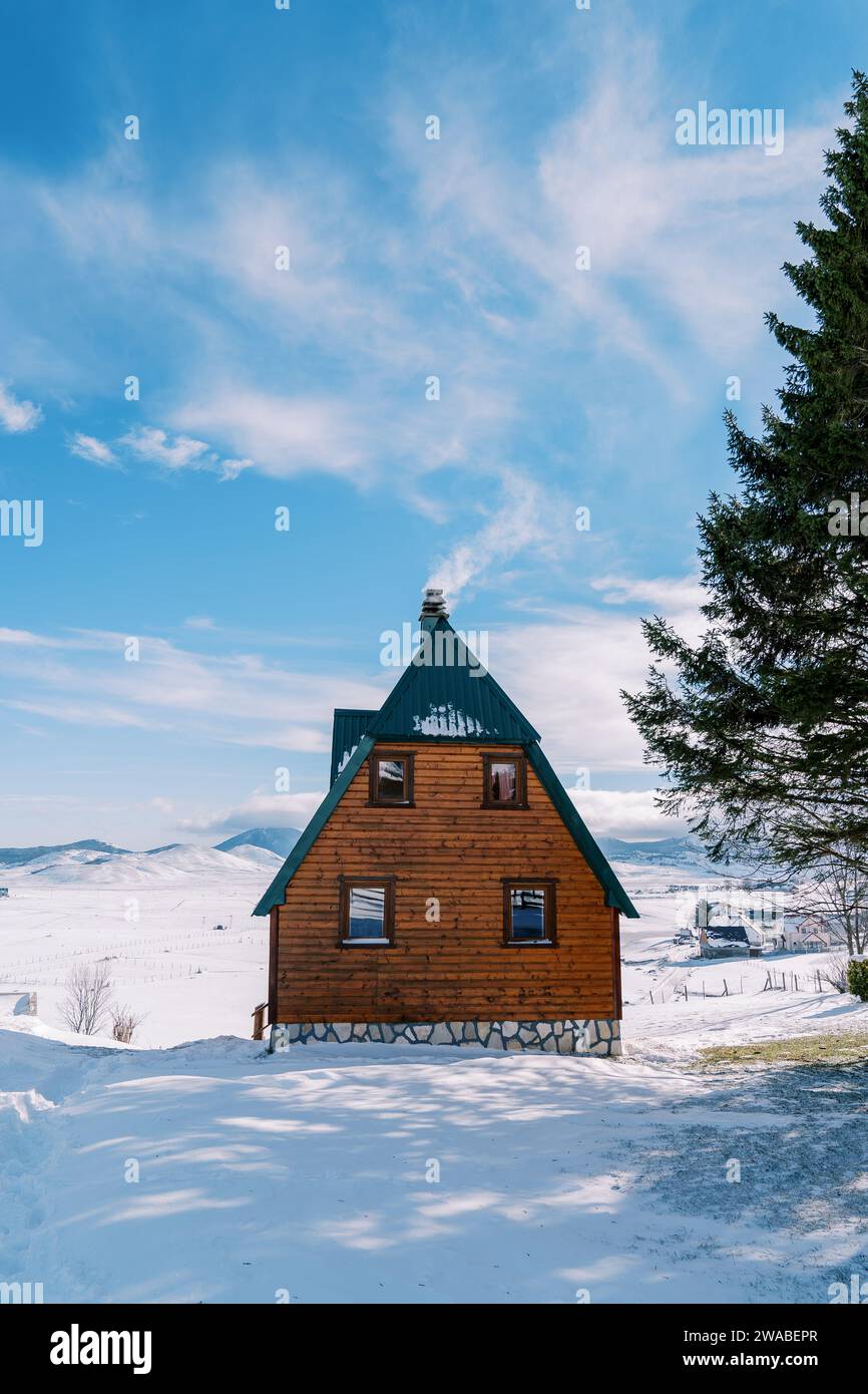 Wooden village house smoke rise hi-res stock photography and images - Alamy